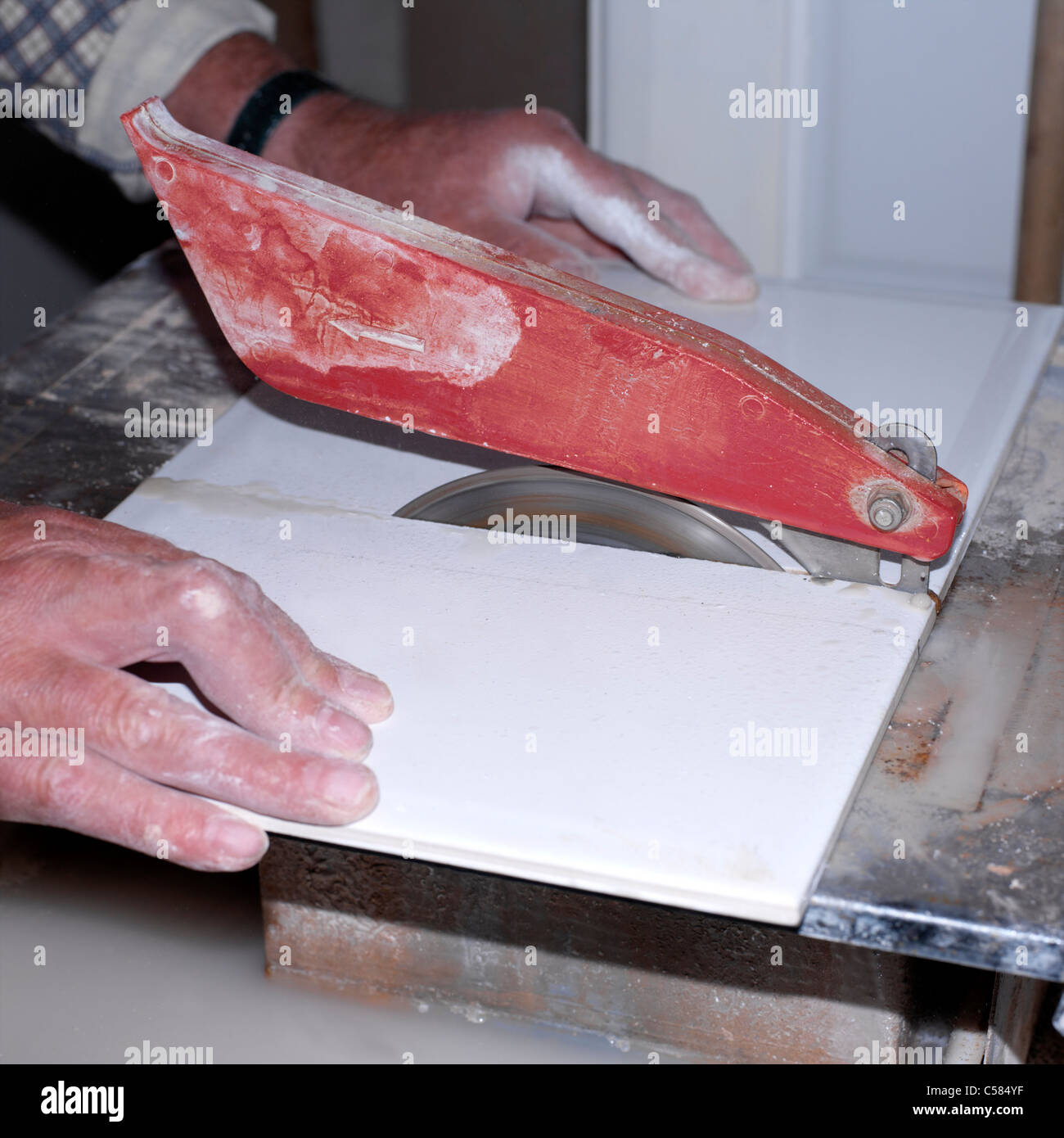 Cutting Tiles with Rotating Saw in New Bathroom Stock Photo - Alamy
