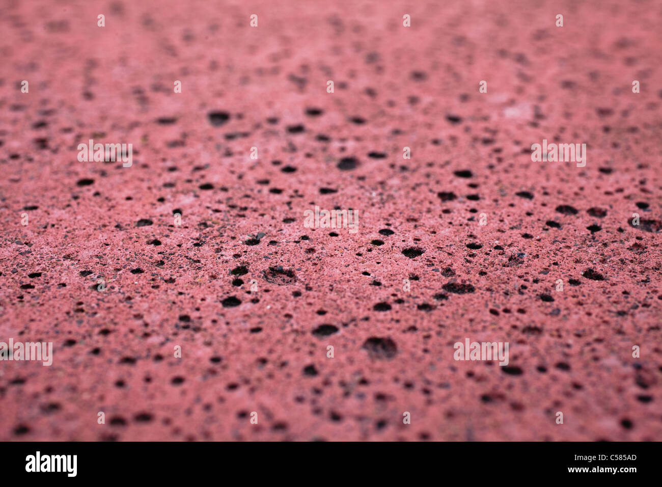 red dyed concrete paving stone Stock Photo - Alamy