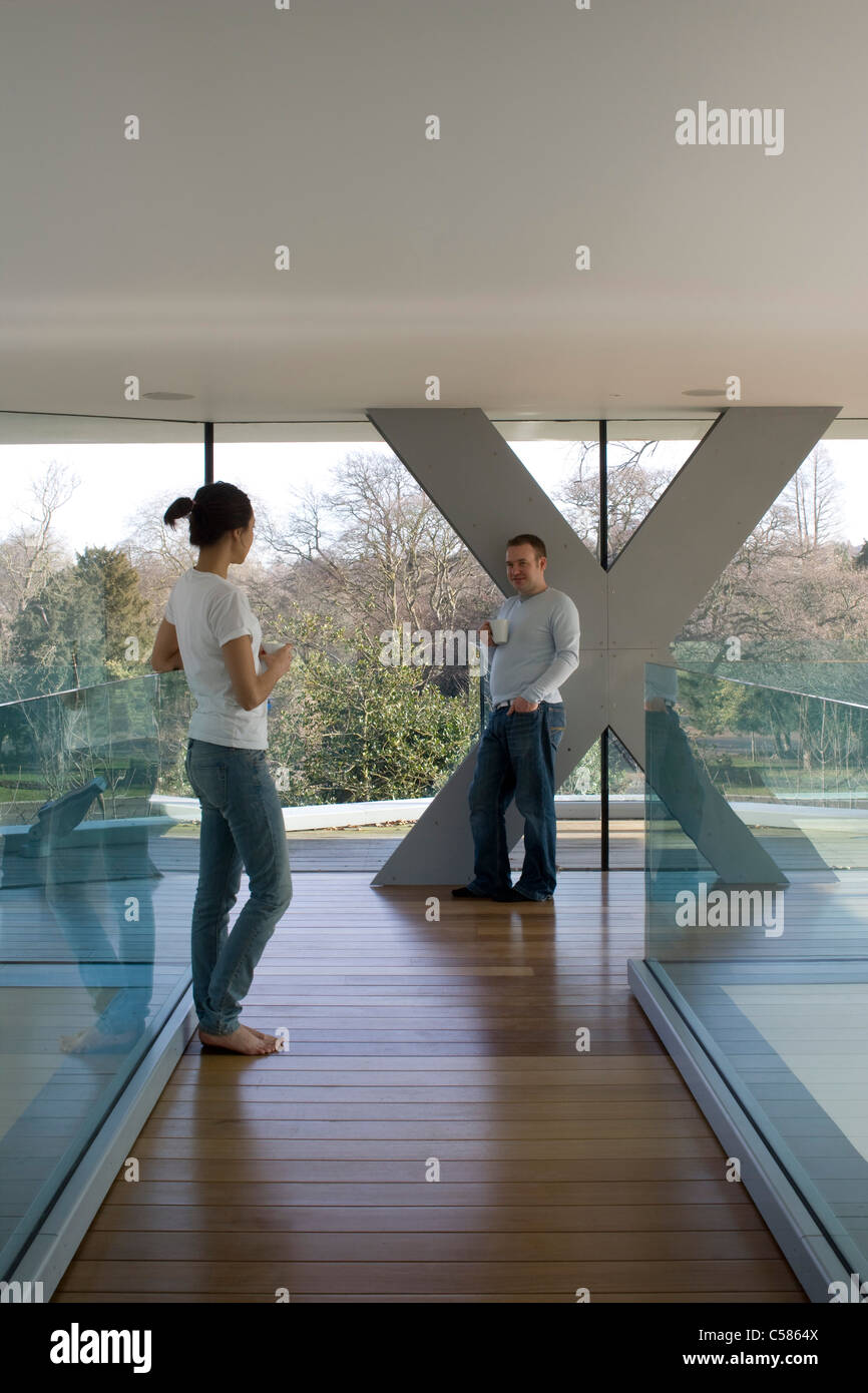 Man and woman drinking at home Stock Photo - Alamy