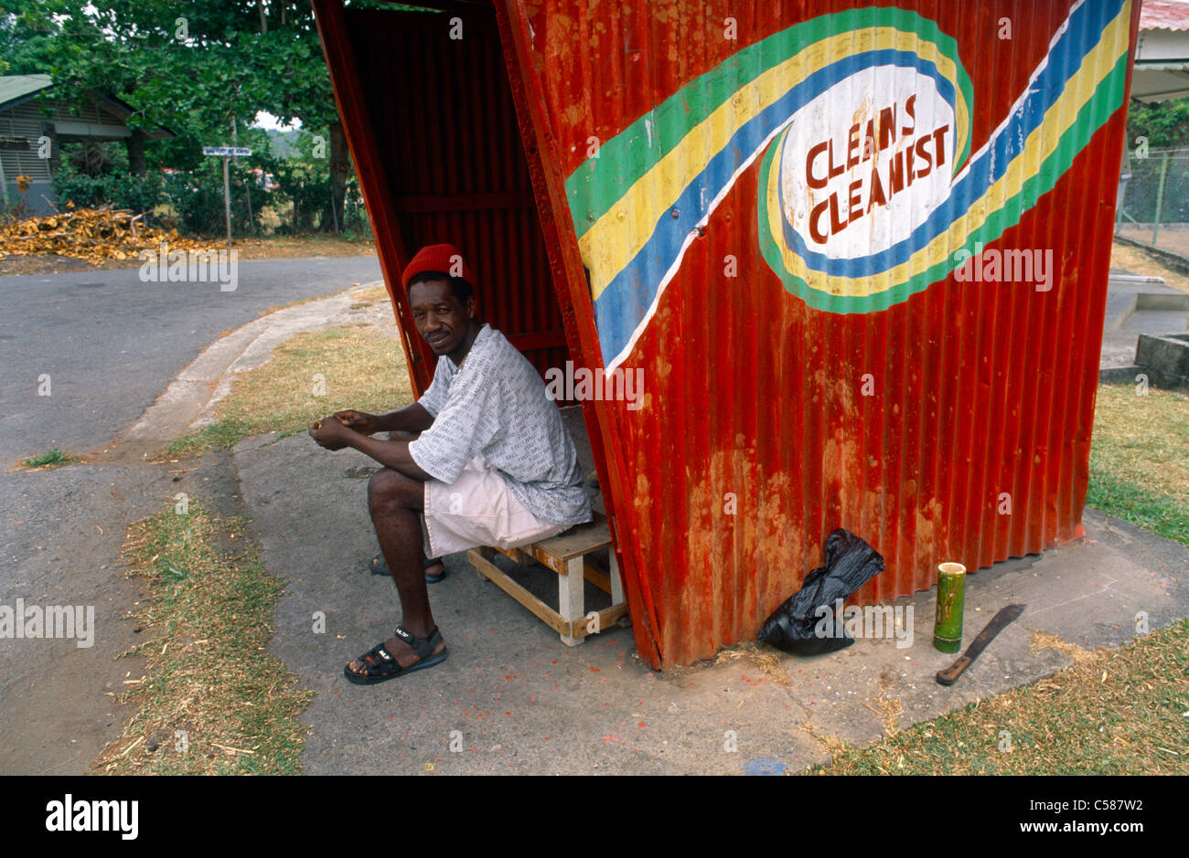 Plymouth Tobago Man Sitting Under Bus Shelter Waiting At Bus Stop Stock ...