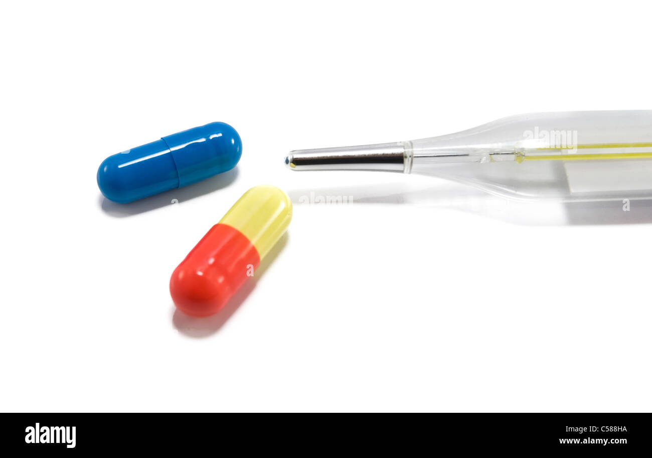 thermometer and pills is isolated on a white background Stock Photo - Alamy