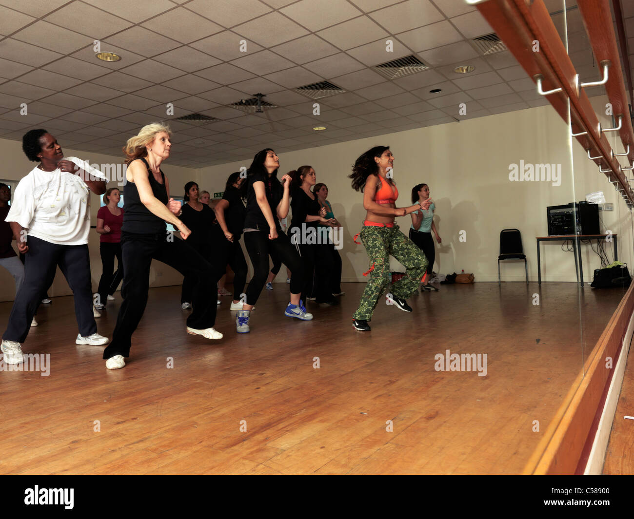 Zumba Dance Fitness Class Fitness Instructor teaching Women Stock Photo ...