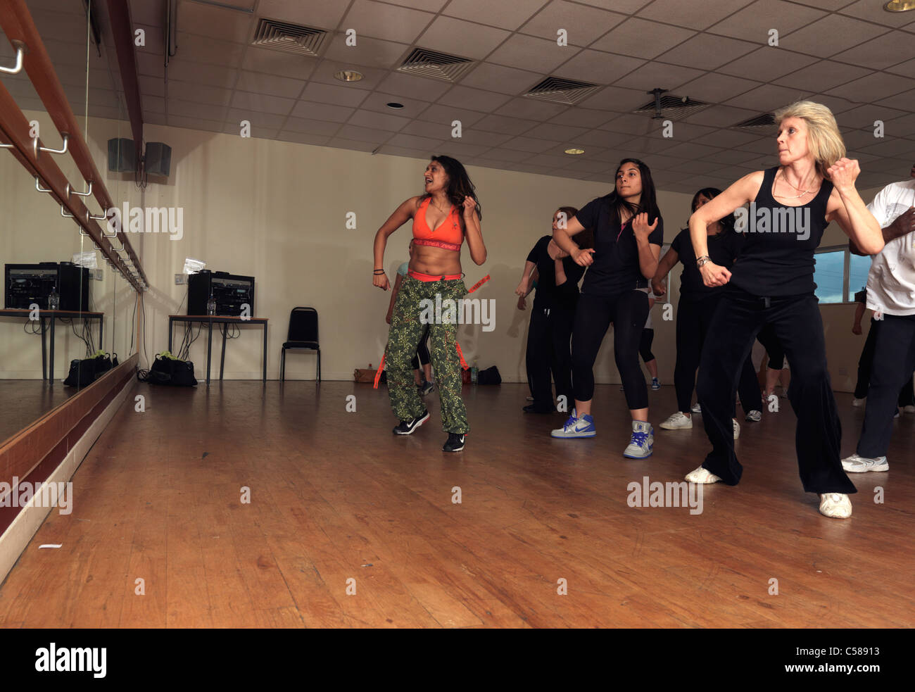 Zumba Dance Fitness Class Fitness Instructor teaching Women Stock Photo ...