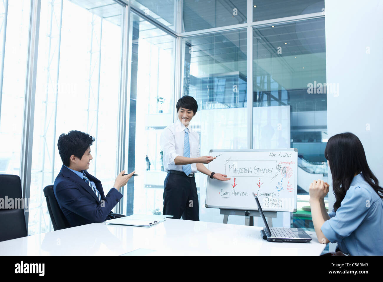 man doing presentation to people in meeting room Stock Photo - Alamy