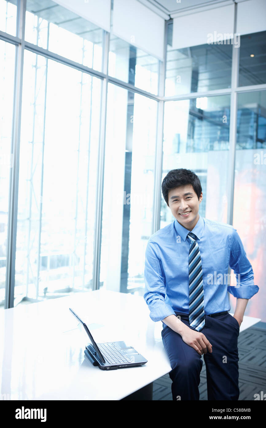 man doing his work using laptop in office Stock Photo - Alamy