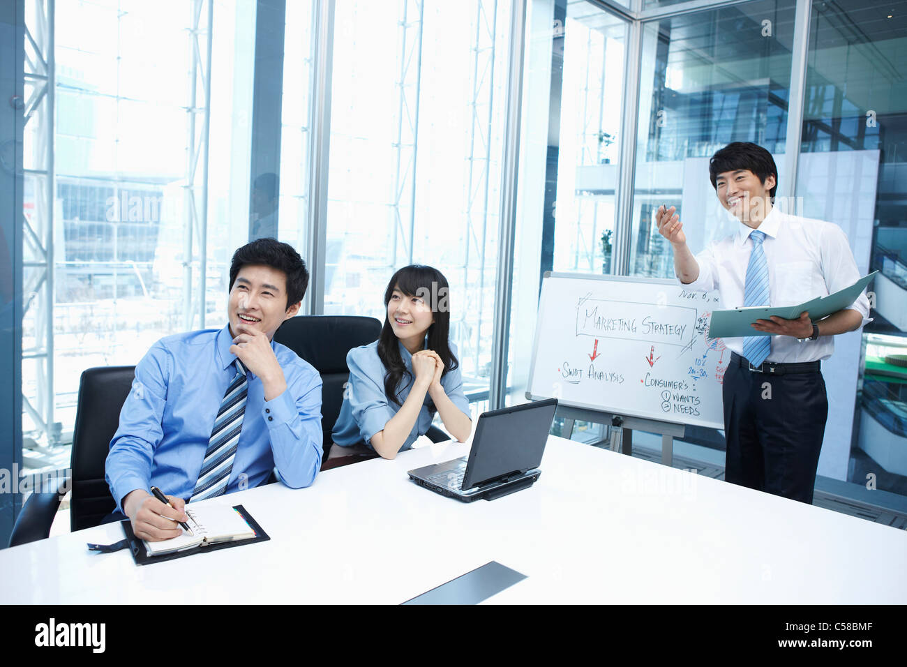 woman doing presentation to people in meeting room Stock Photo - Alamy
