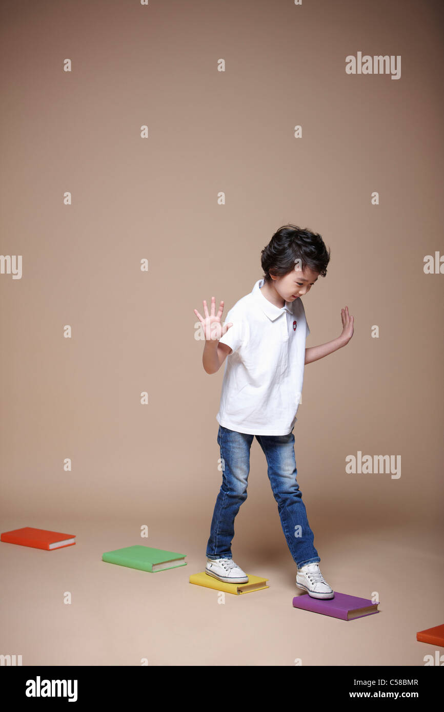 Boy stepping stones hi-res stock photography and images - Alamy