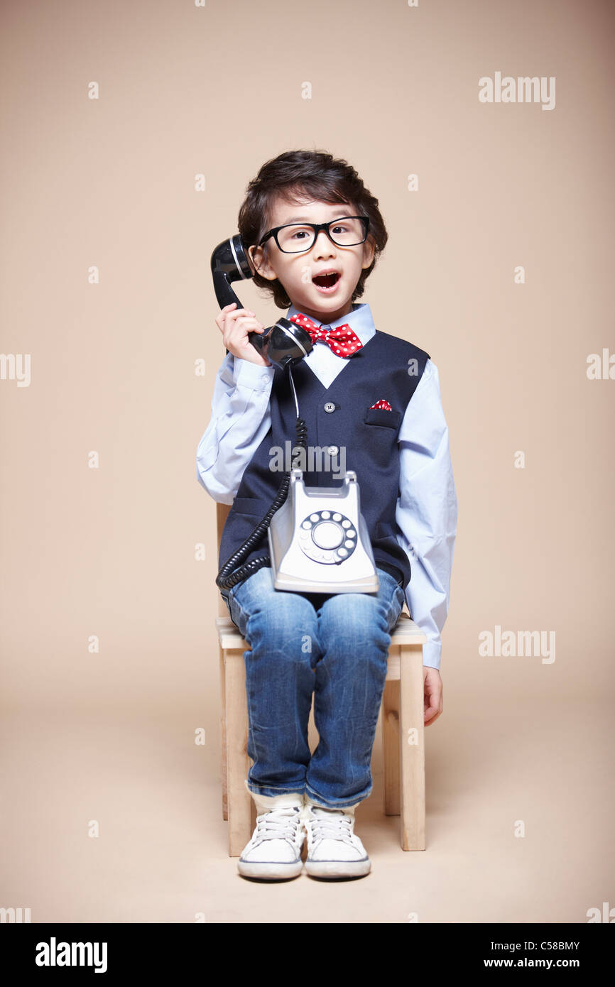 boy answering the phone Stock Photo - Alamy
