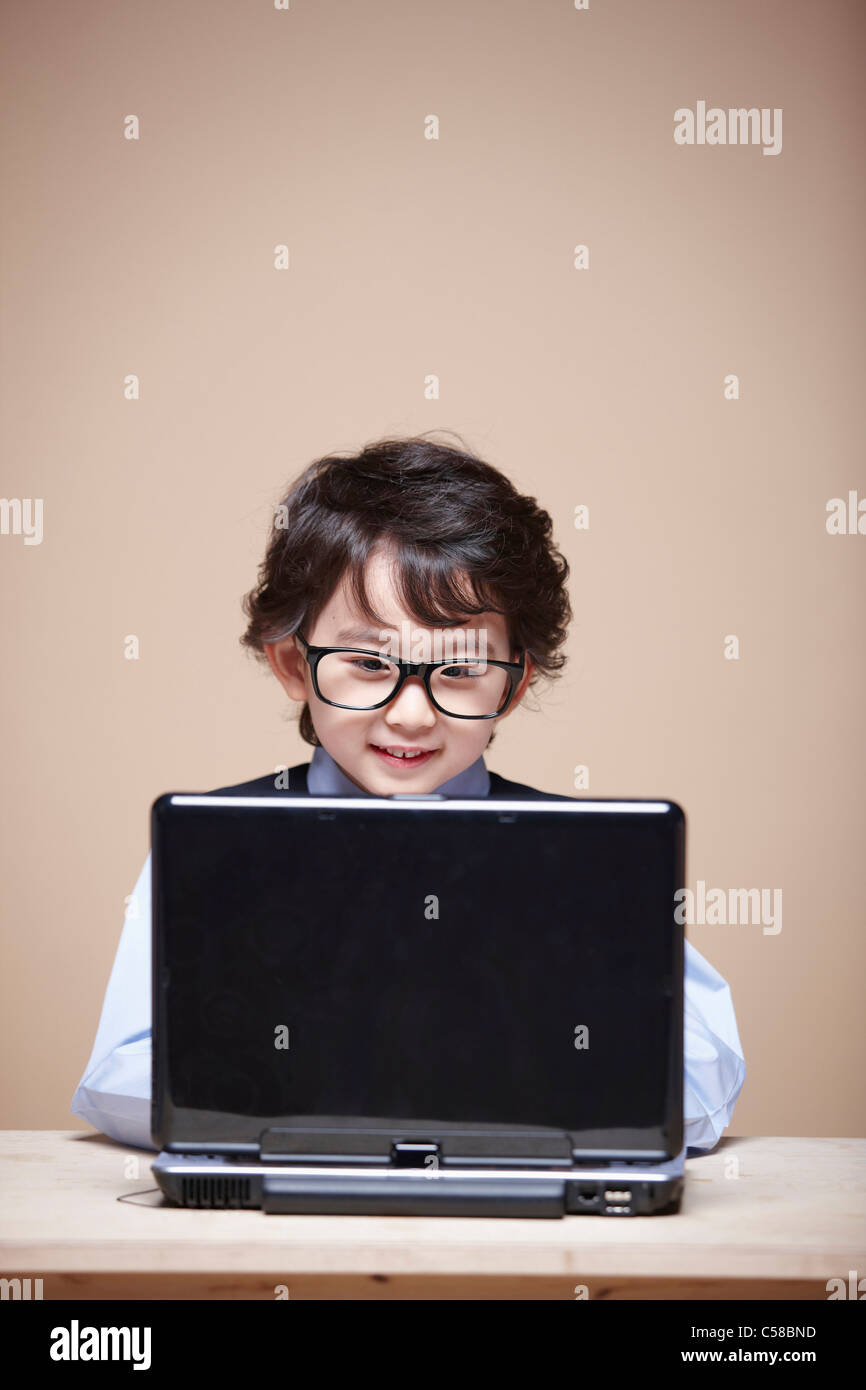 boy is studying using laptop Stock Photo - Alamy