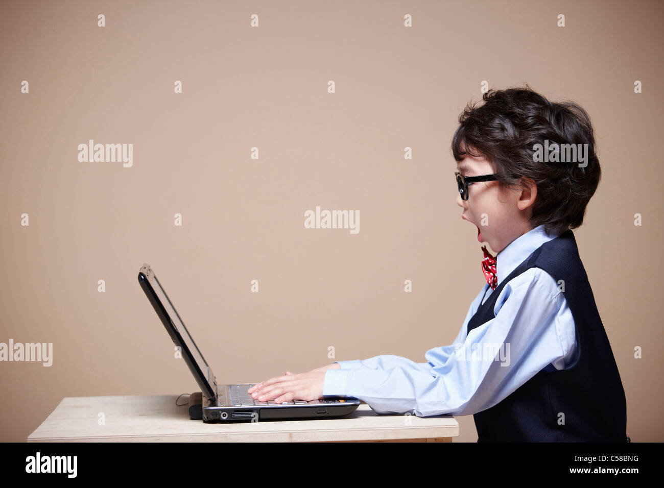 boy is studying using laptop Stock Photo - Alamy