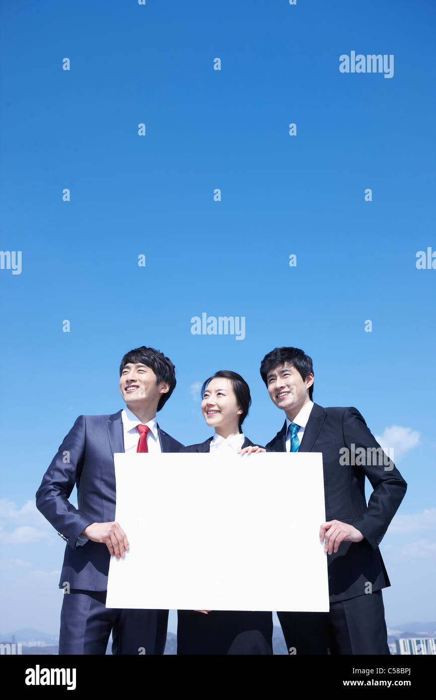businessmen holding panels Stock Photo - Alamy