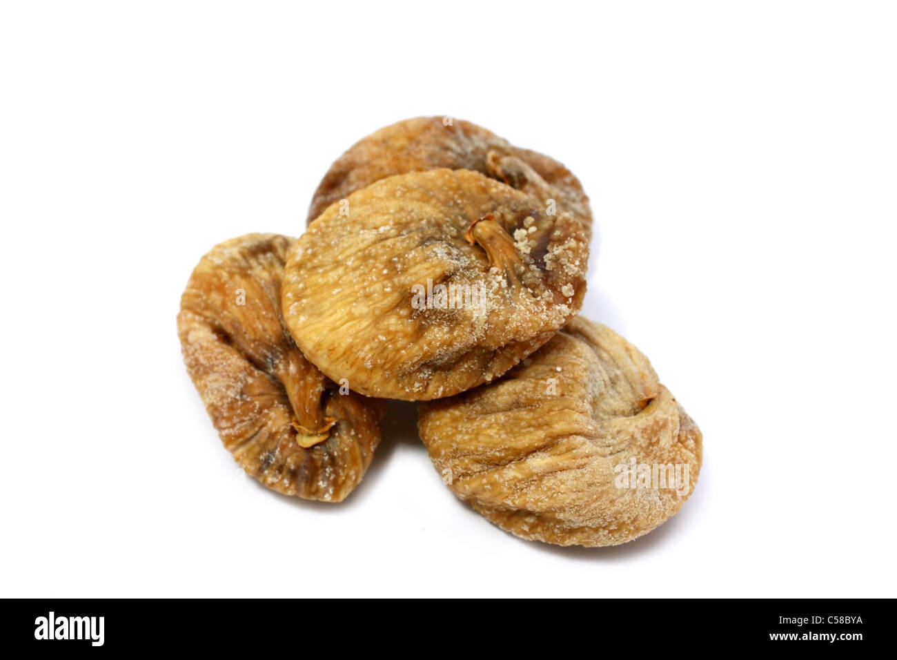 four dry figs close up on white background Stock Photo - Alamy