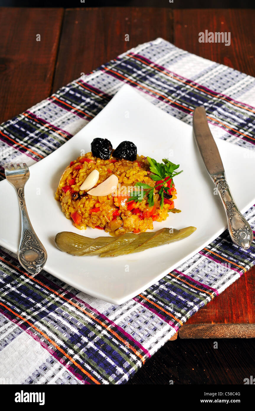 Pilaf with dried plums Stock Photo - Alamy