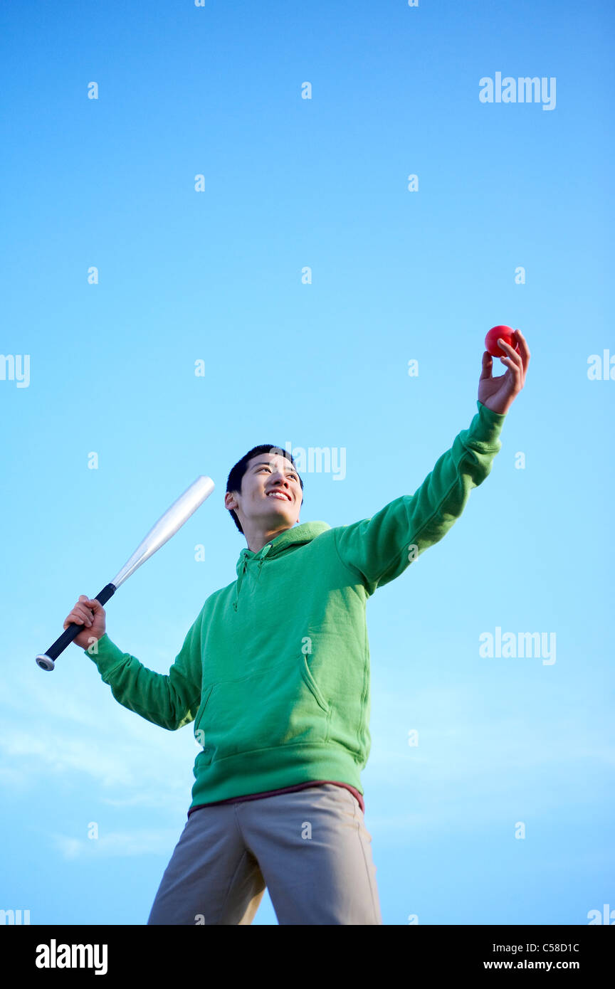 Teenage boy holding baseball bat Stock Photo - Alamy
