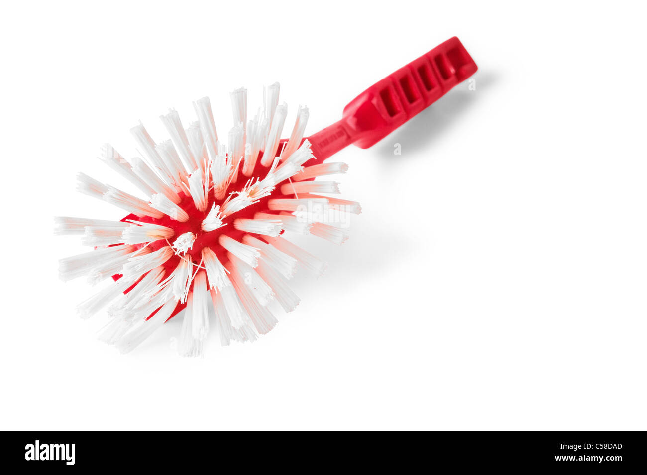 Red dish brush on white background with shadow Stock Photo - Alamy