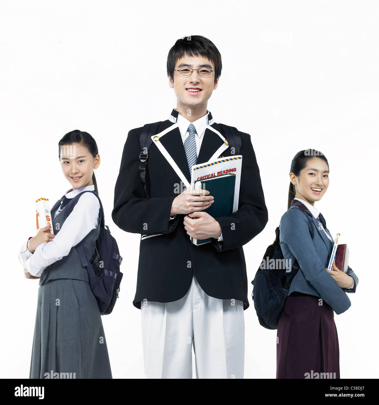 Portrait of teens standing with books Stock Photo - Alamy