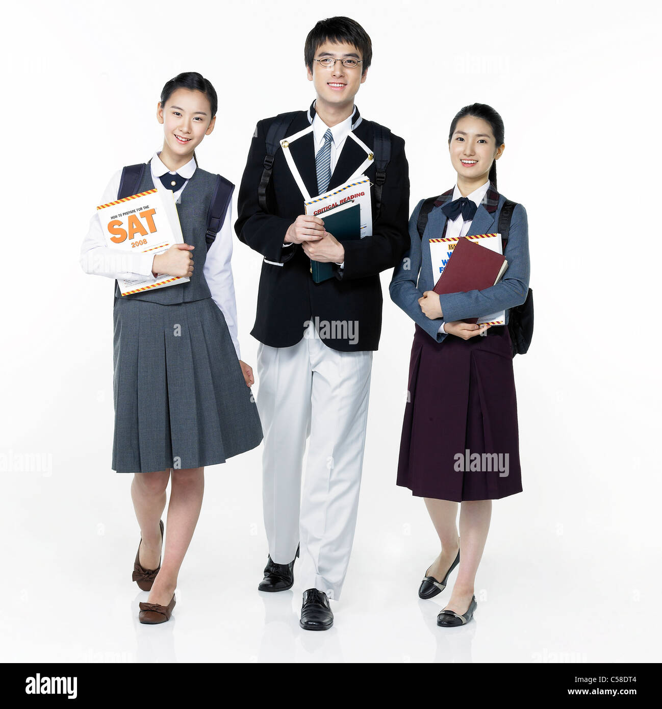 Portrait of teens holding book Stock Photo - Alamy