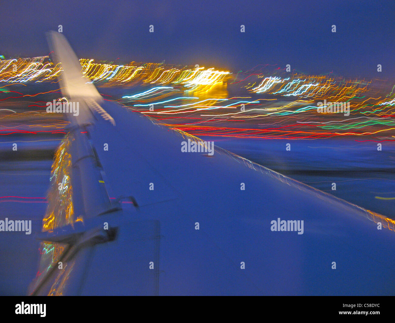 Airplane wing at night Stock Photo - Alamy