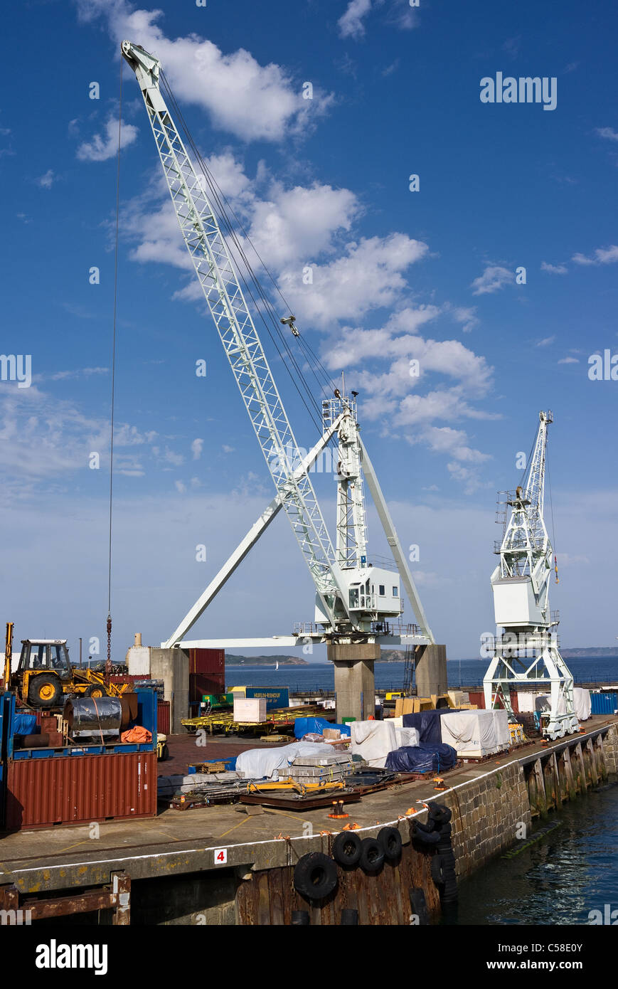 Quayside cranes on jetty in St Peter Port Guernsey Channel Islands UK ...