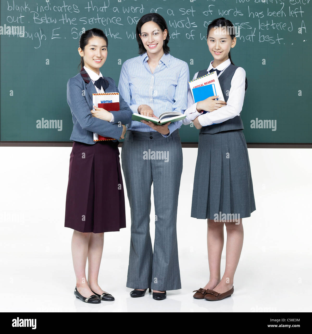 Portrait of student and teacher standing by blackboard Stock Photo - Alamy