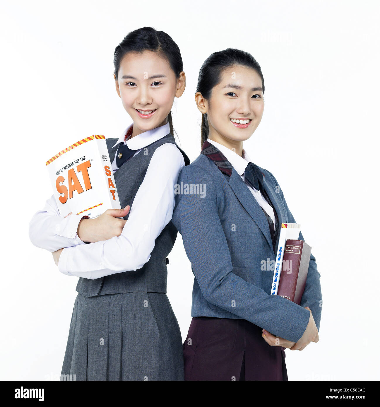 Portrait of teens holding books Stock Photo - Alamy