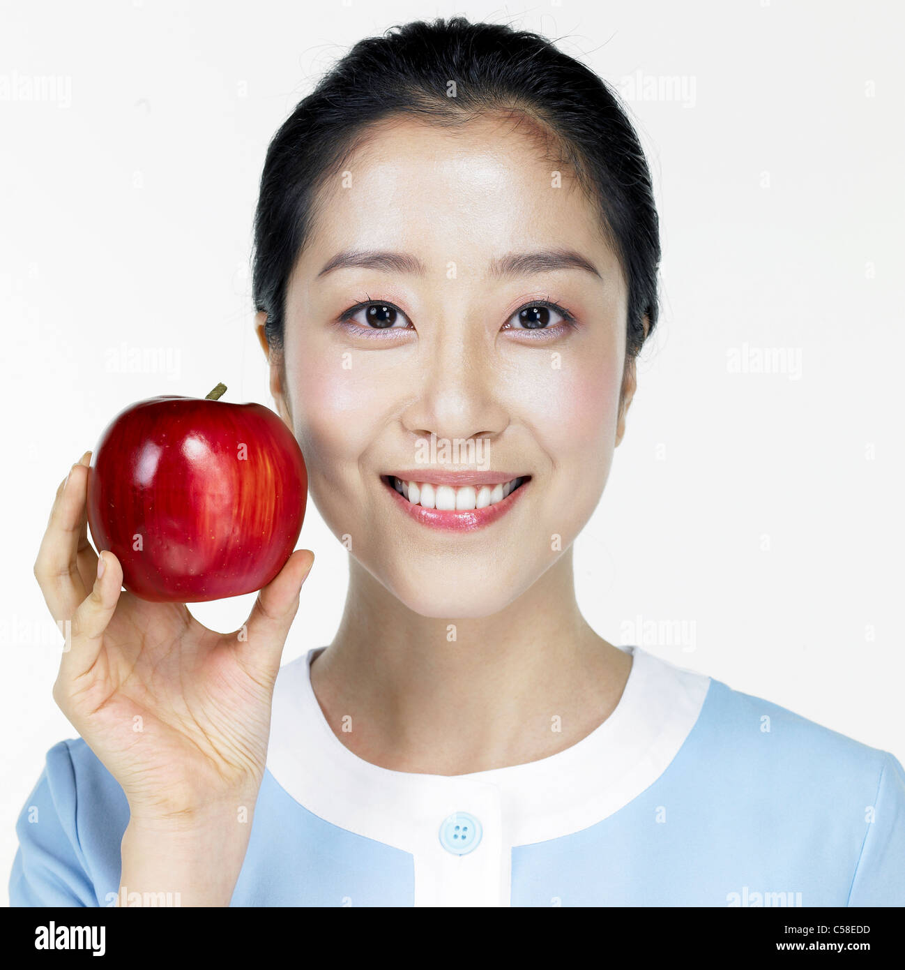 Portrait of Doctor Holding Apple Stock Photo - Alamy
