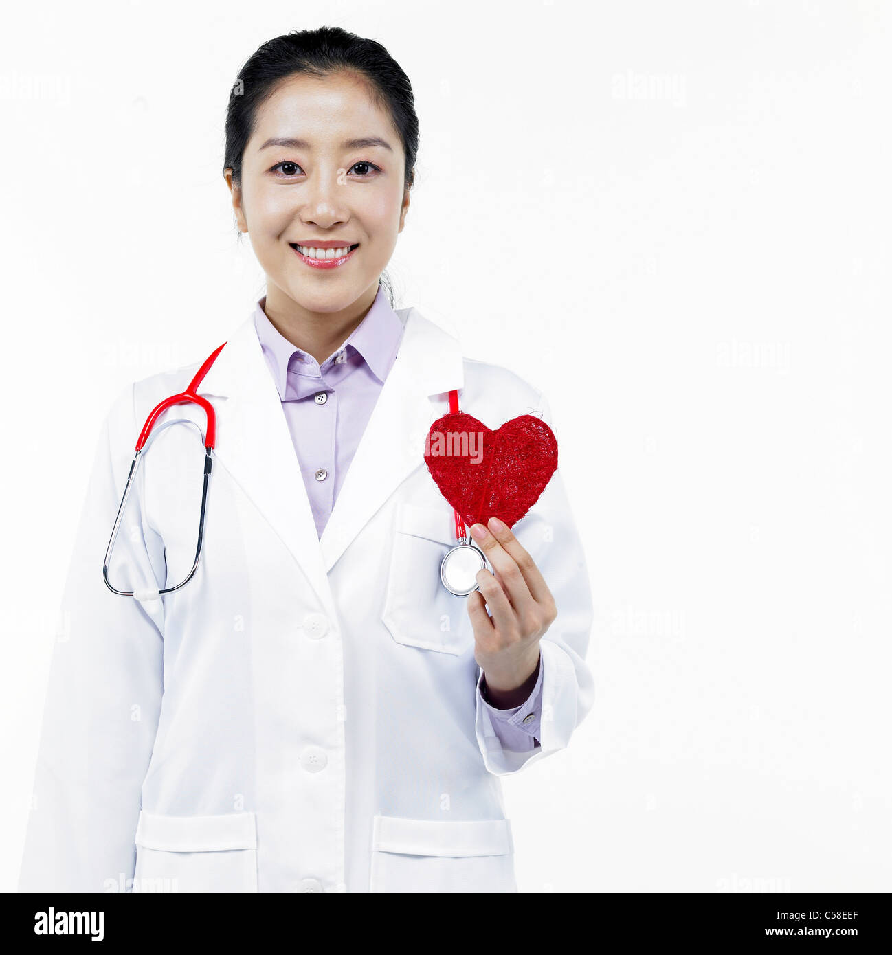 Portrait of Doctor Holding Heart shape Stock Photo - Alamy