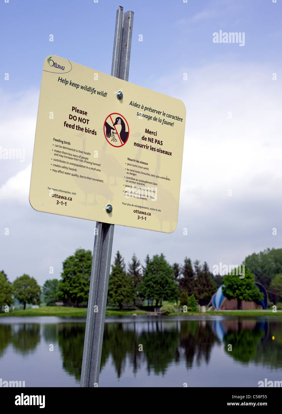 Dual language sign in riverside park in Ottawa Stock Photo - Alamy