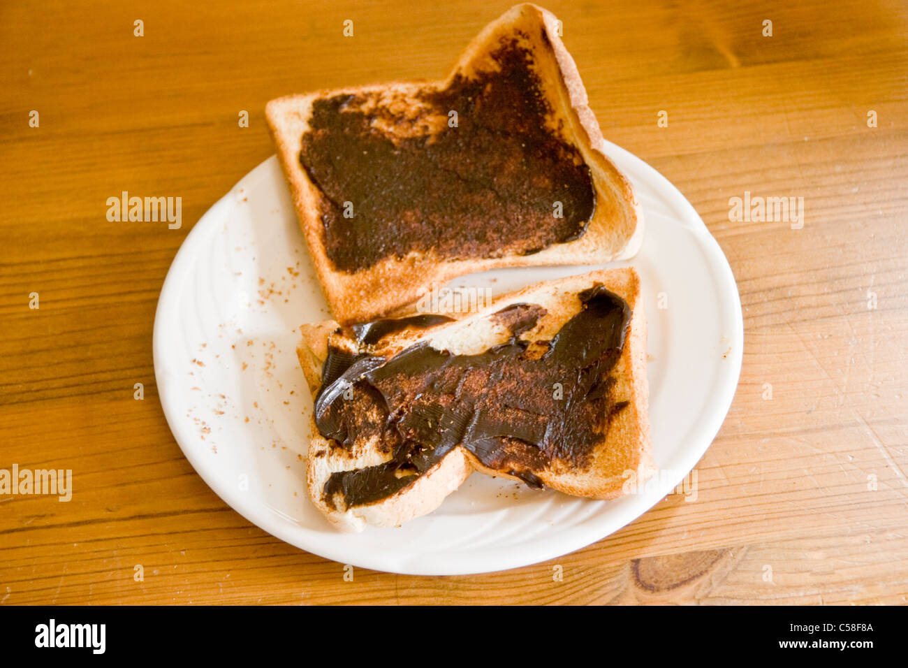 Plate with toast and Marmite Stock Photo - Alamy