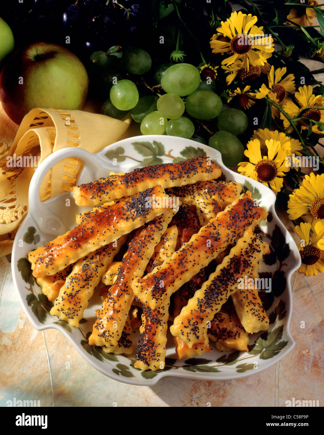 Flaky pastry sticks with poppy seeds Stock Photo - Alamy
