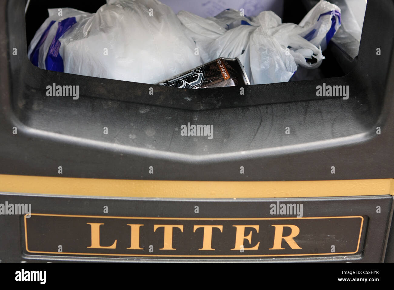 The mouth of a litter bin full of rubbish Stock Photo - Alamy