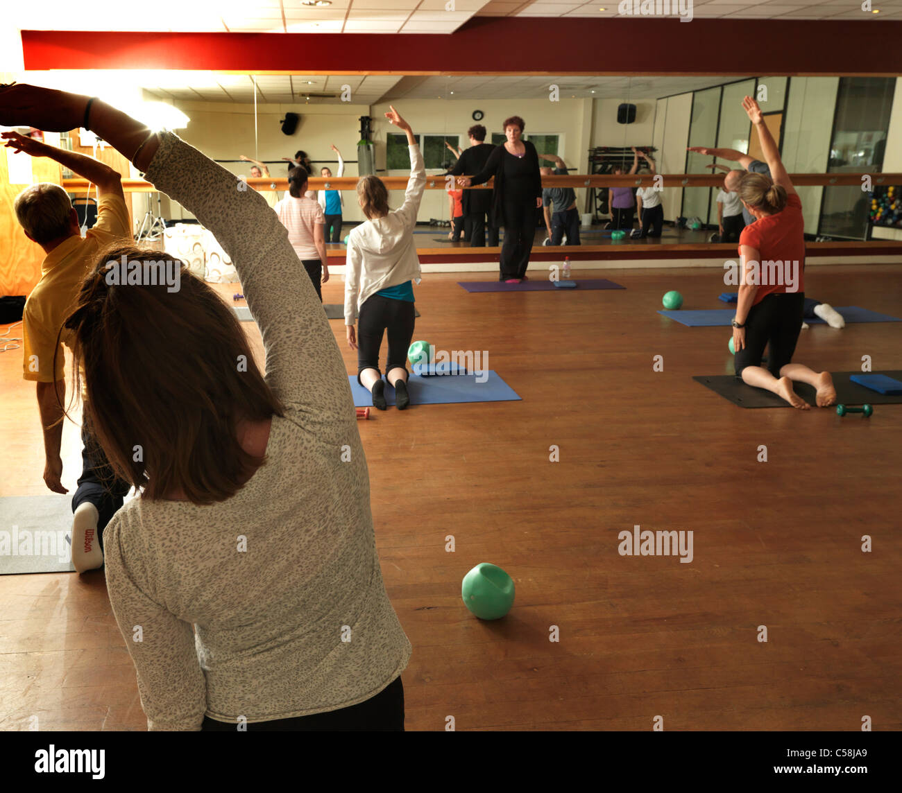 Fitness Instructor Teaching Pilates Physical Fitness Class Stock Photo ...