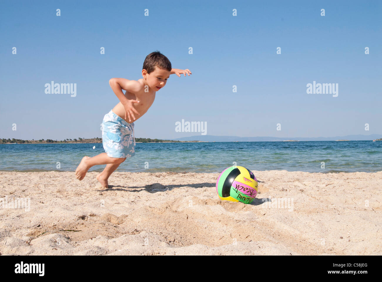 boy playing on the beach Stock Photo - Alamy