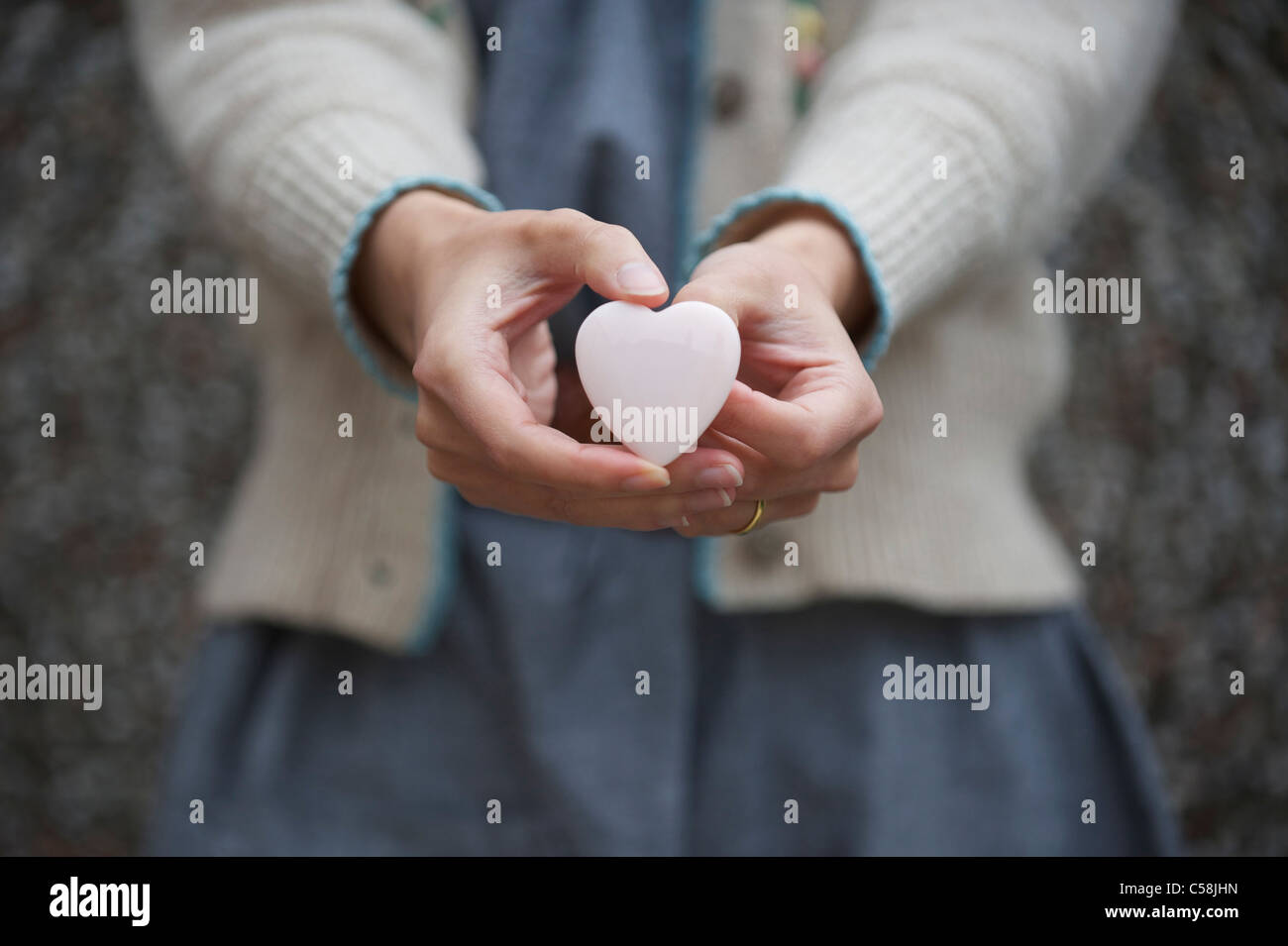 Giving your heart hi-res stock photography and images - Alamy