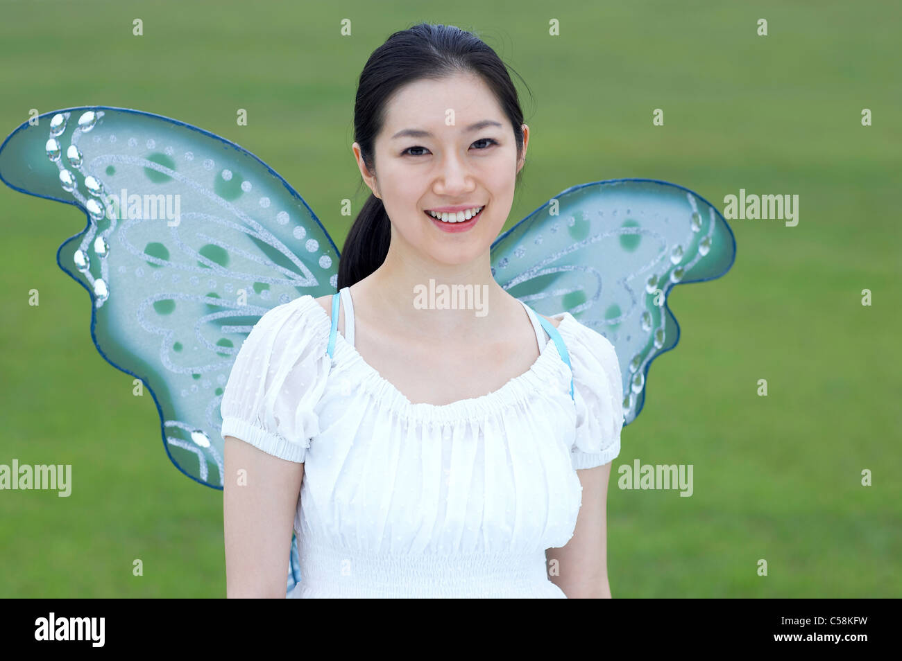 Portrait of young woman with wings Stock Photo - Alamy