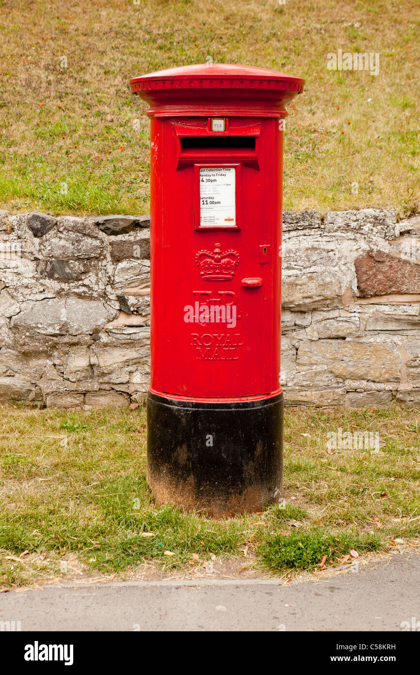A red UK cast-iron Royal Mail freestanding Pillar Box with an EiiR ...