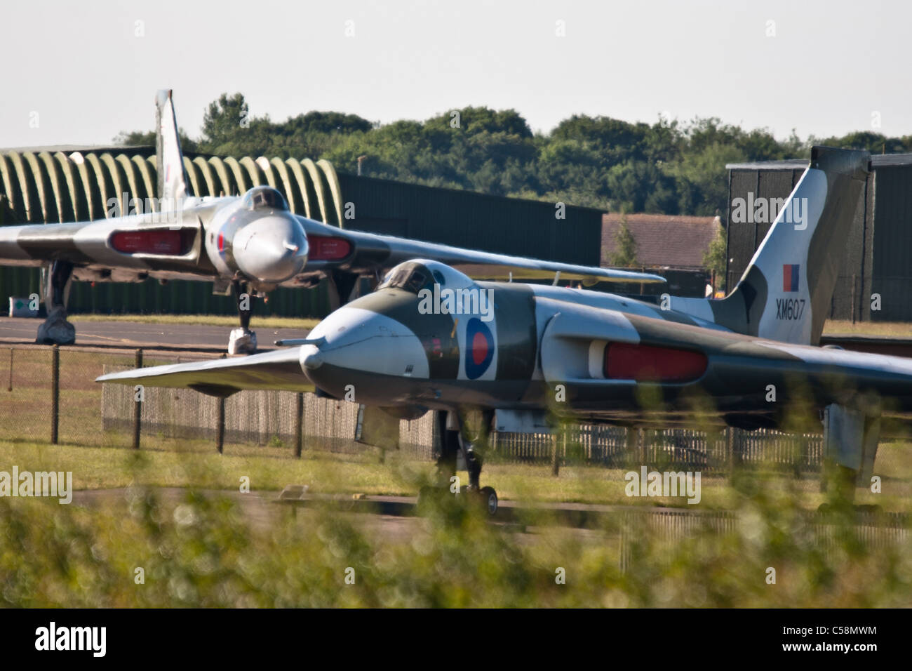 Avro Vulcan's XM607 and XH558 G-VLCN at RAF Waddington Stock Photo - Alamy