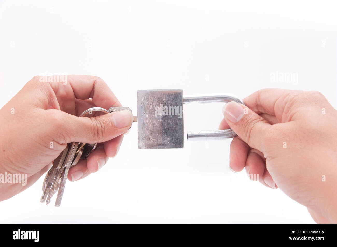 A key and hand in action Stock Photo - Alamy