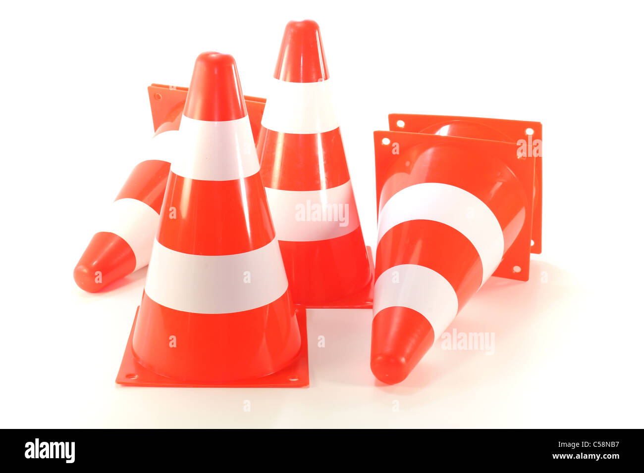 red and white pylons on a white background Stock Photo - Alamy
