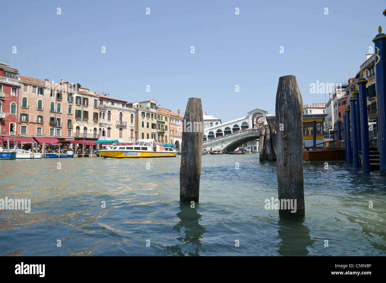 Two Mooring Posts hide the Rialto Bridge on the Grand Canal, Venice ...