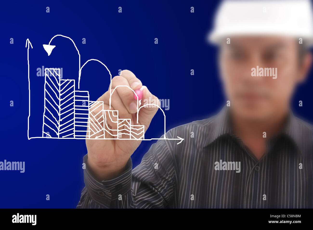 A man is writing a graph for analysis Stock Photo - Alamy