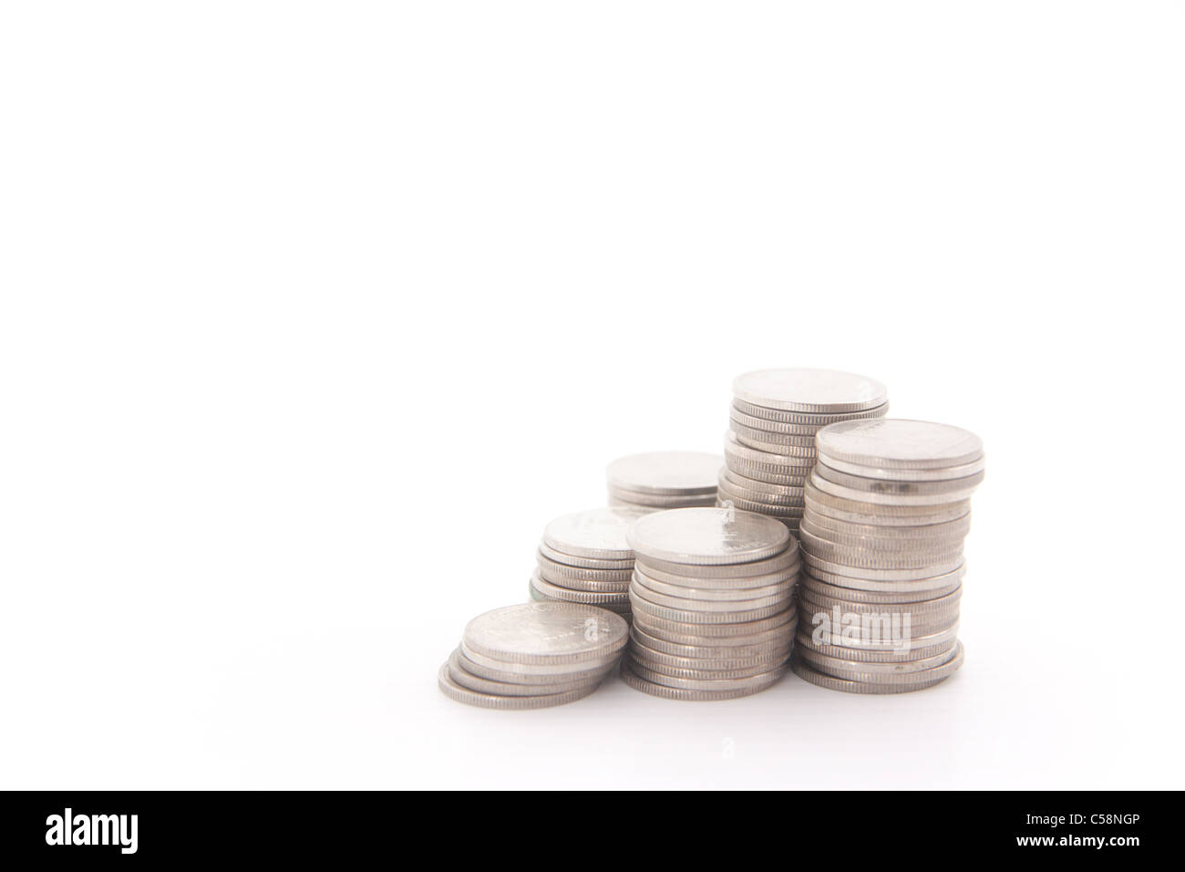 Stack money on a white isolate Stock Photo - Alamy