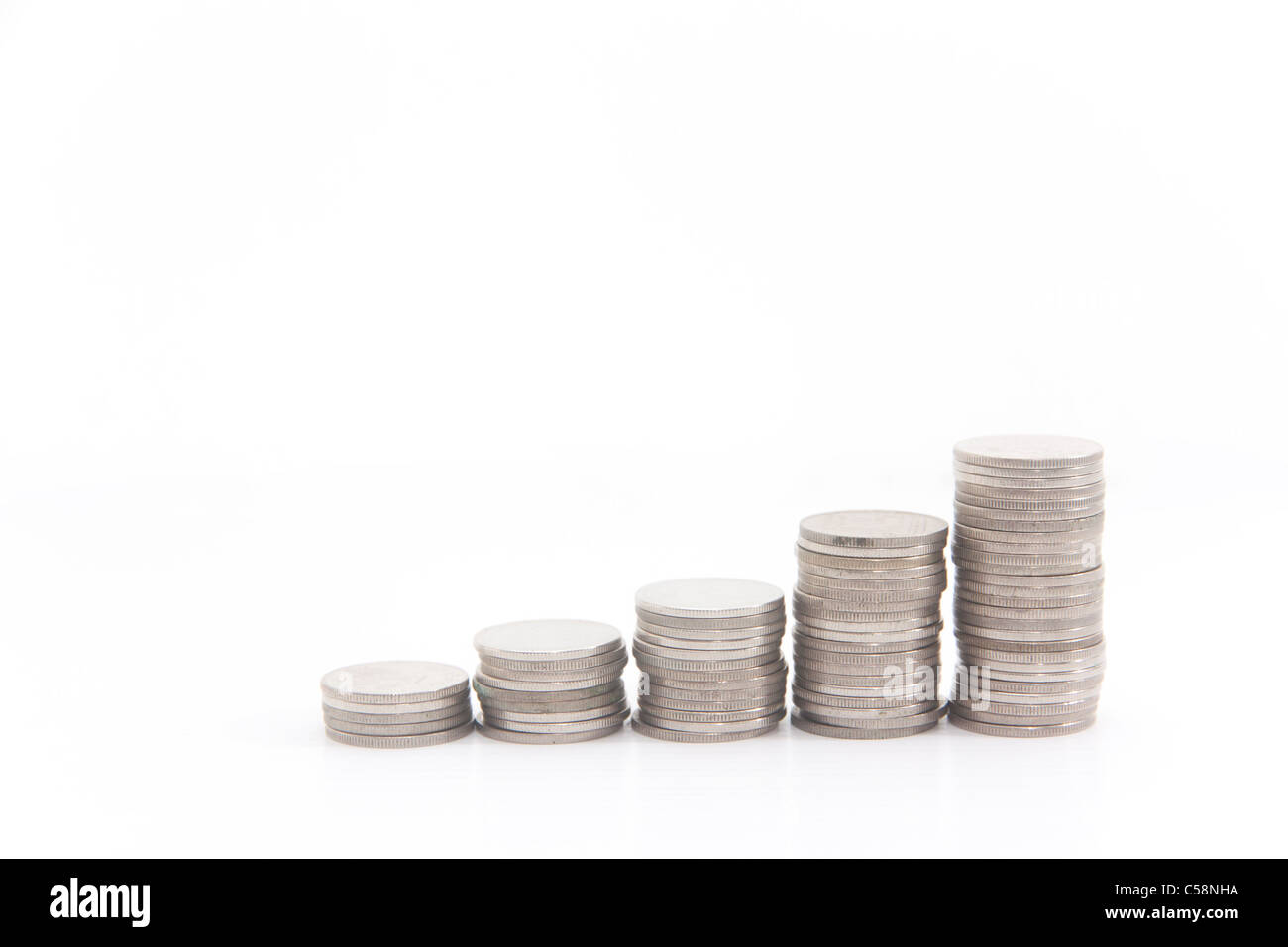 Stack money on a white isolate Stock Photo - Alamy