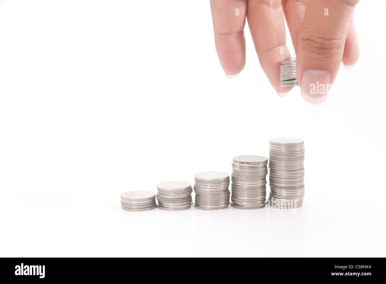 Stack money and a hand in action on white isolate Stock Photo - Alamy