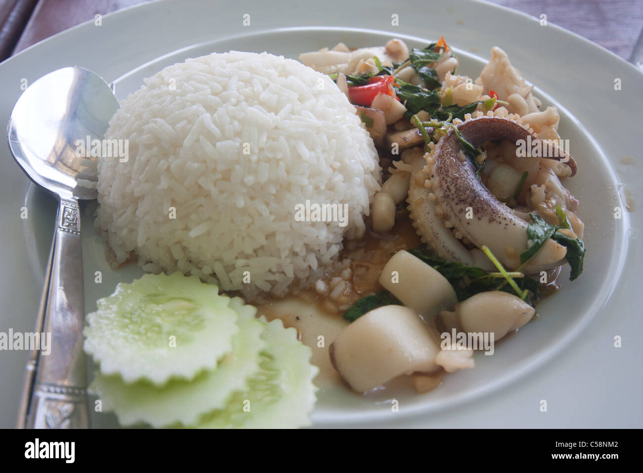 Squid fire rice Stock Photo - Alamy