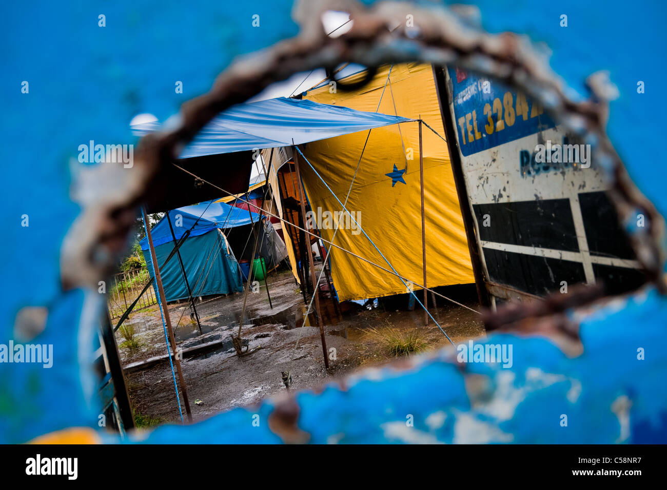 A view through a ticket office showing temporary tents at the Circo ...
