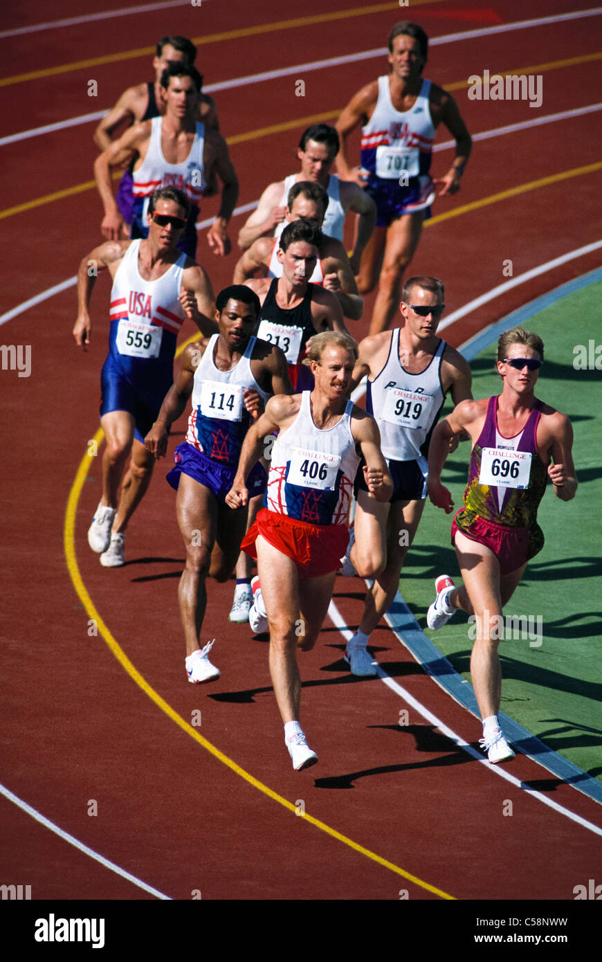 Male runners competing in a track race Stock Photo - Alamy