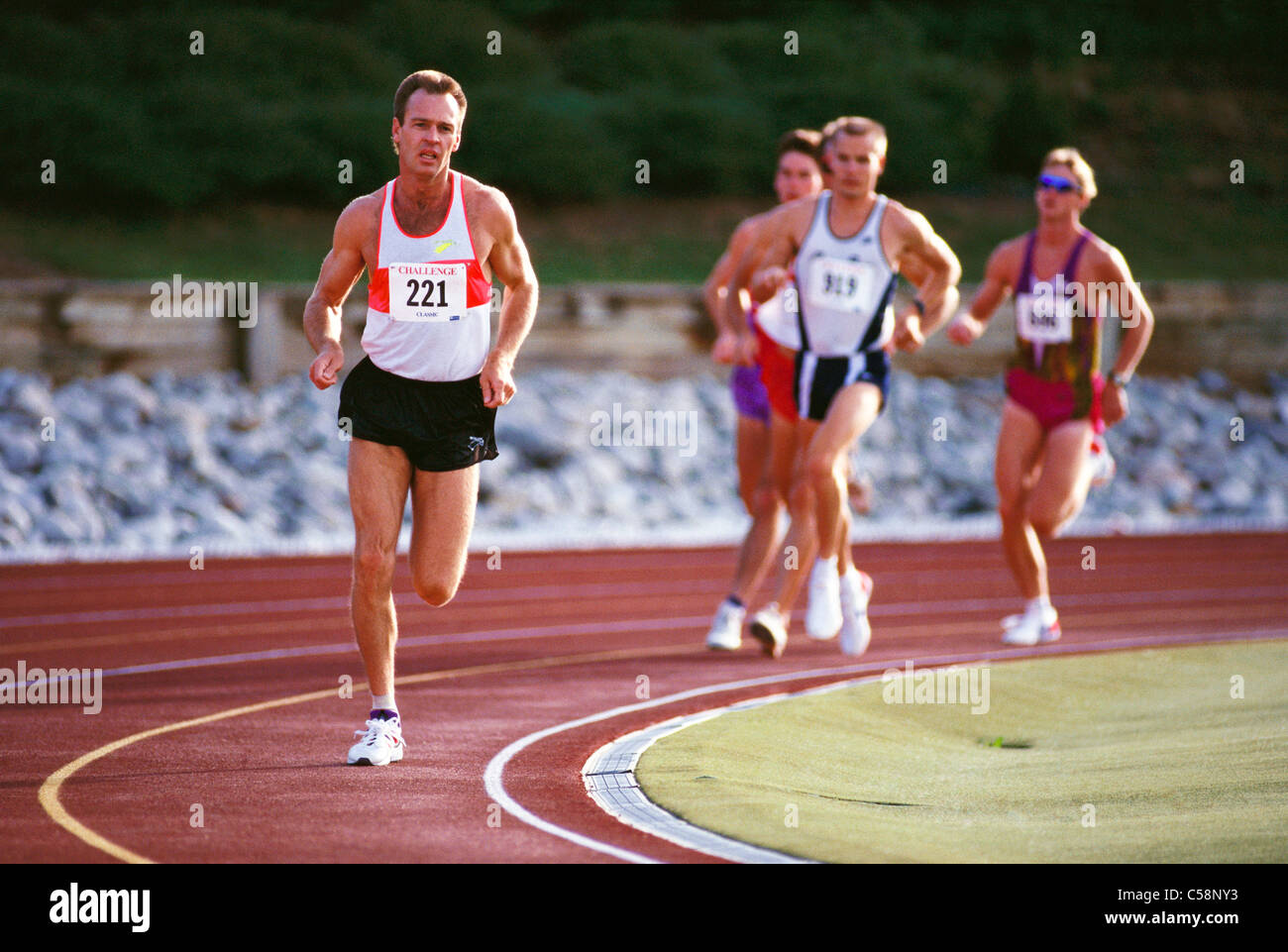 Male runners competing in a track race Stock Photo - Alamy