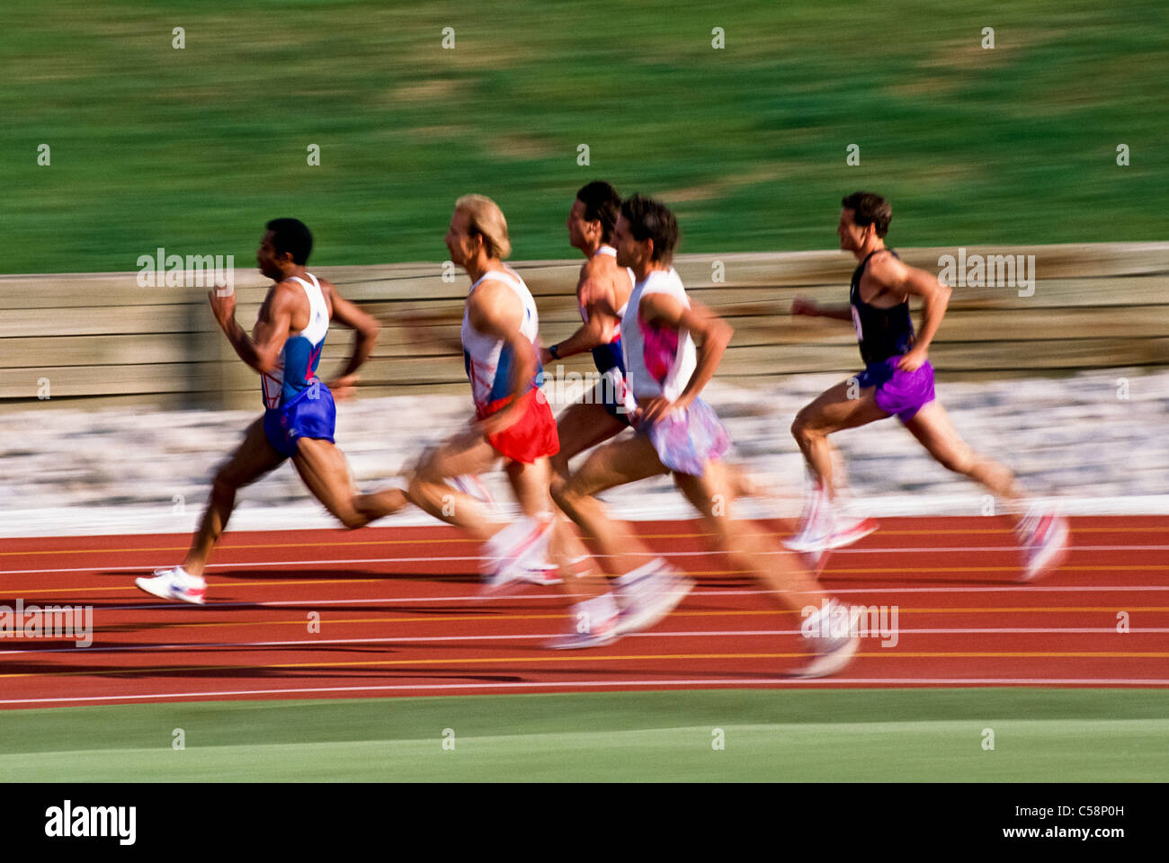 Male runners competing in a track race Stock Photo - Alamy