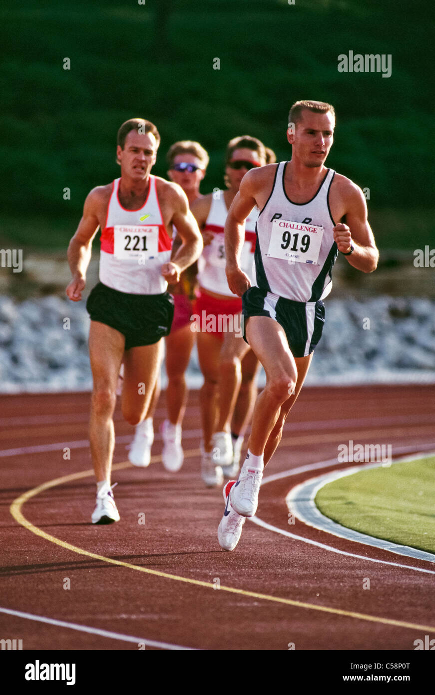 Male runners competing in a track race Stock Photo - Alamy